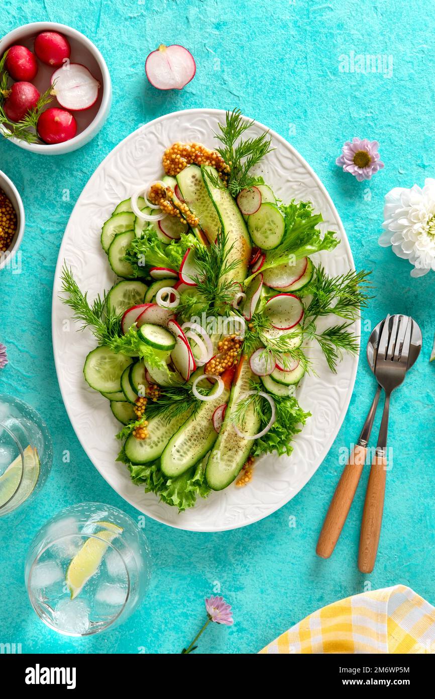 Fresh mixed vegetables salad with cucumber, radish and tomato. Summer ...