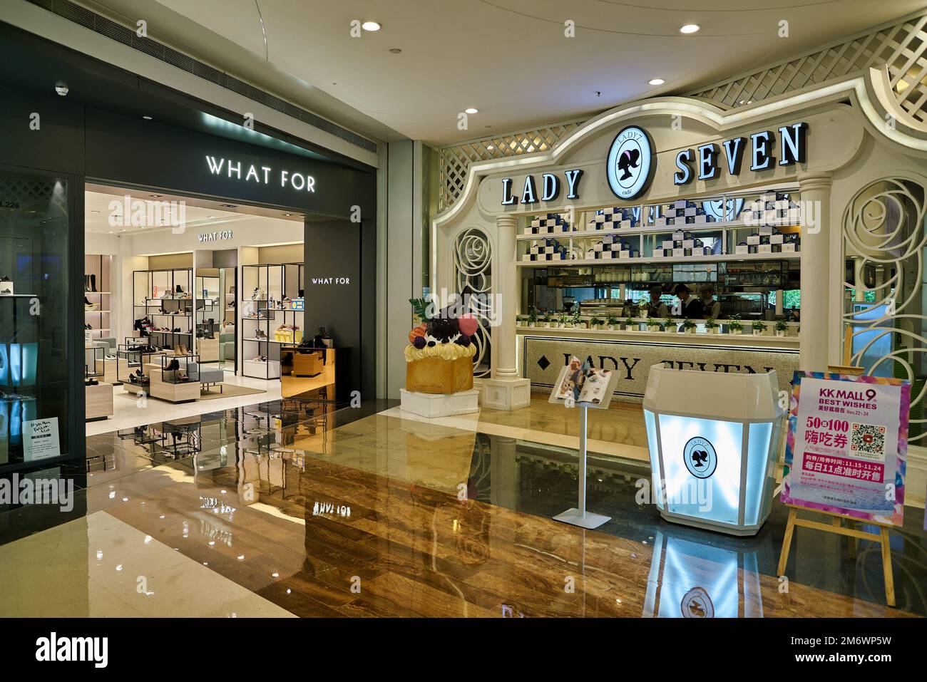 SHENZHEN, CHINA - CIRCA NOVEMBER, 2019: What For storefron and Lady ...