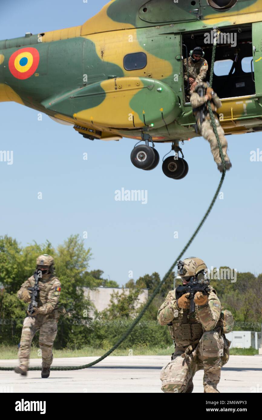 Members of Romanian Naval Special Operations Forces (NAVSOF) pull ...