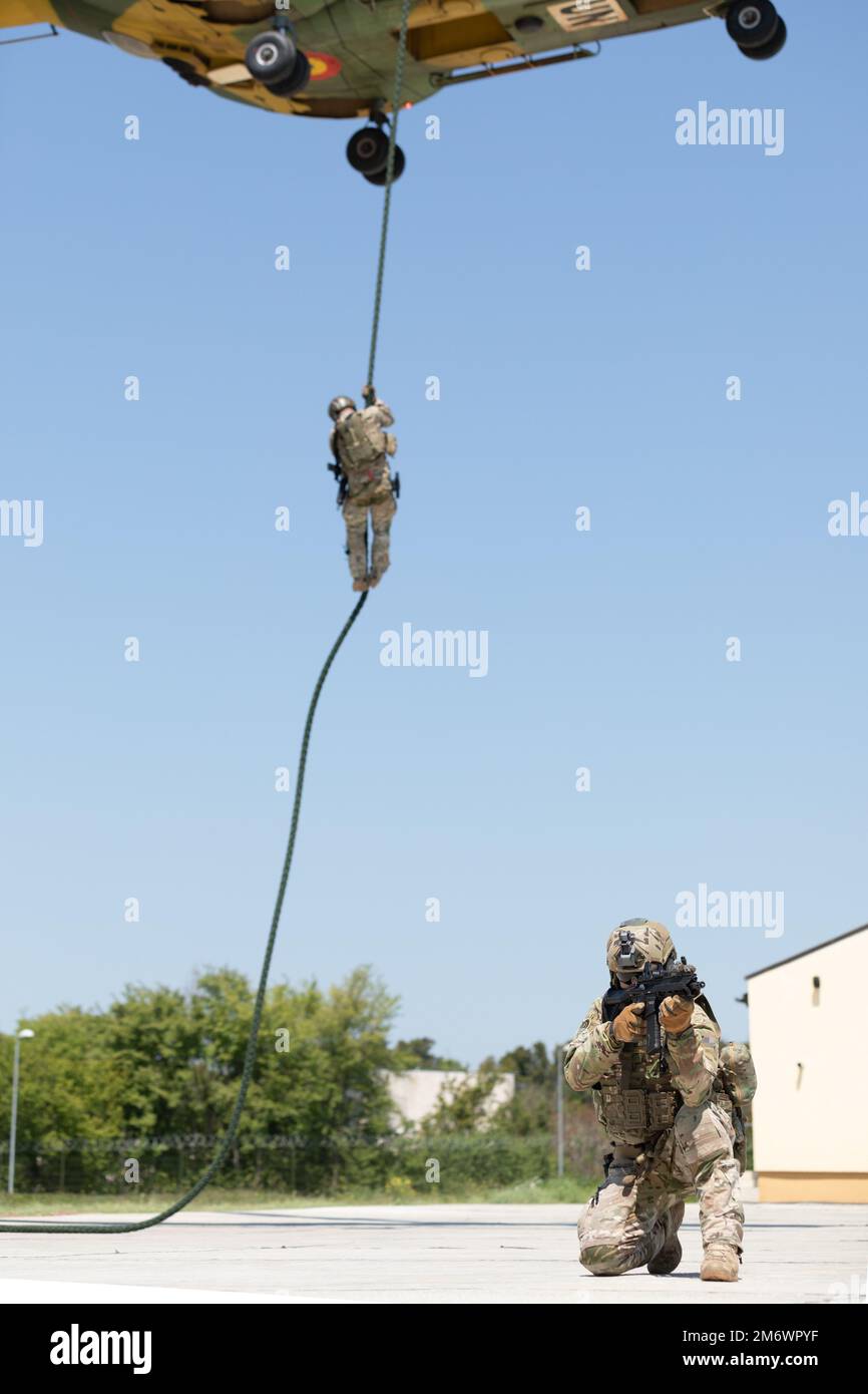 A member of Romanian Naval Special Operations Forces (NAVSOF) descends ...