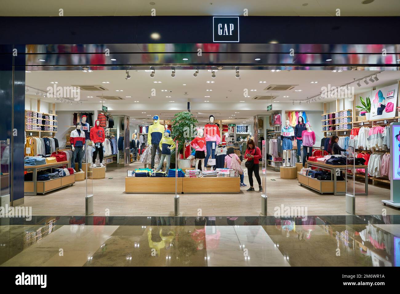 SHENZHEN, CHINA - CIRCA NOVEMBER, 2019: apparel on display at GAP store in Shenzhen Stock Photo ...