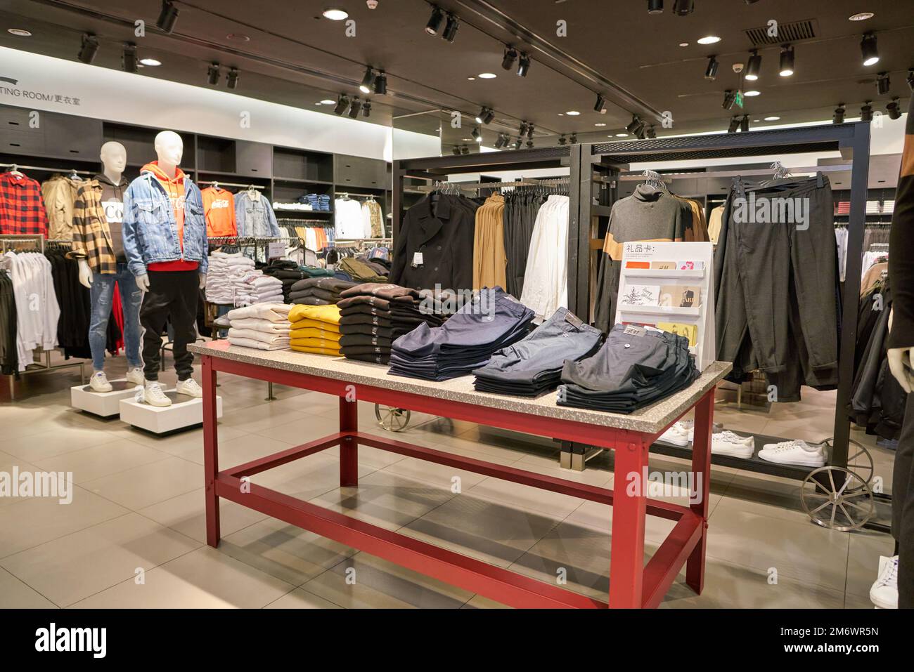 SHENZHEN, CHINA - CIRCA NOVEMBER, 2019: apparel on display at H and M ...
