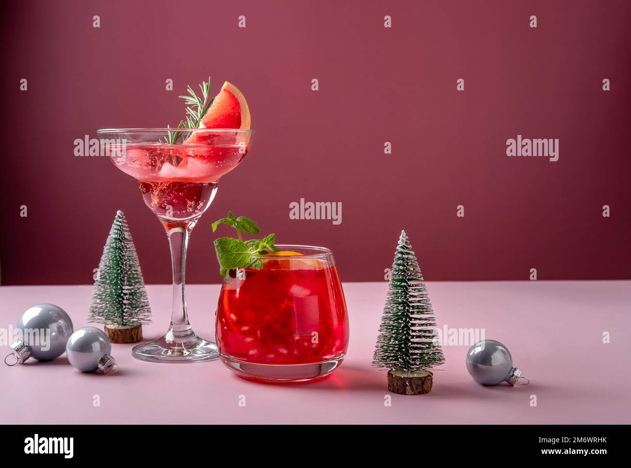 Two festive cocktails with various citrus. Assortment of alcohol ...