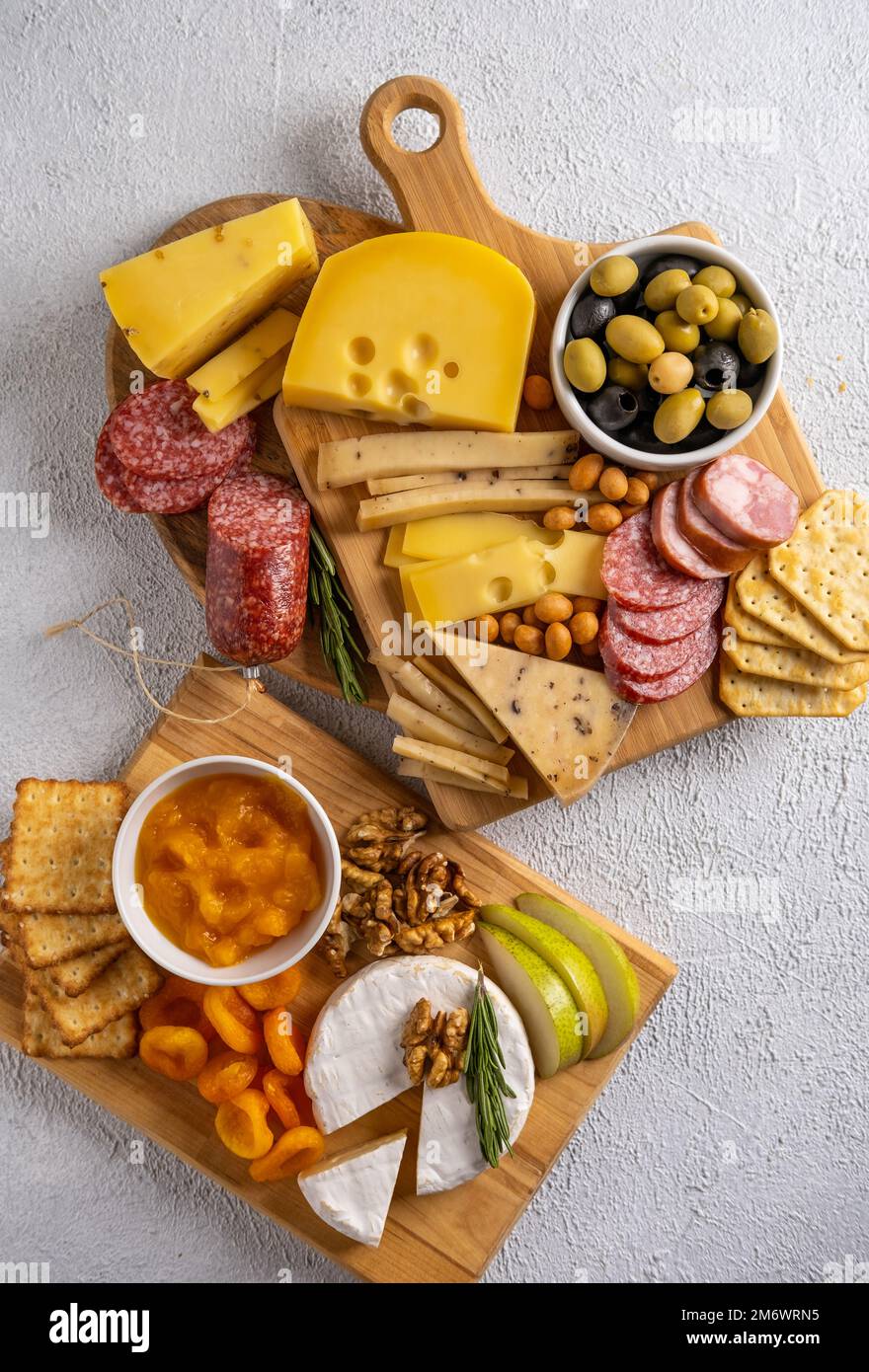 Different types of cheeses and cold cut meats. Top view on a white ... Different types of cheeses and cold cut meats. Top view on a white ...