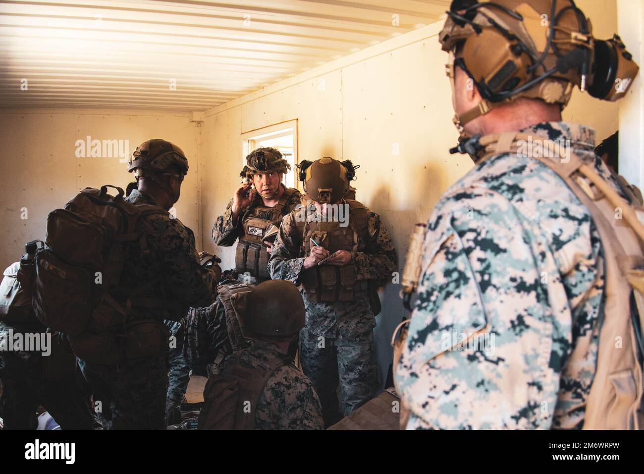 U.S. Navy hospital corpsmen with I Marine Expeditionary Force converse ...