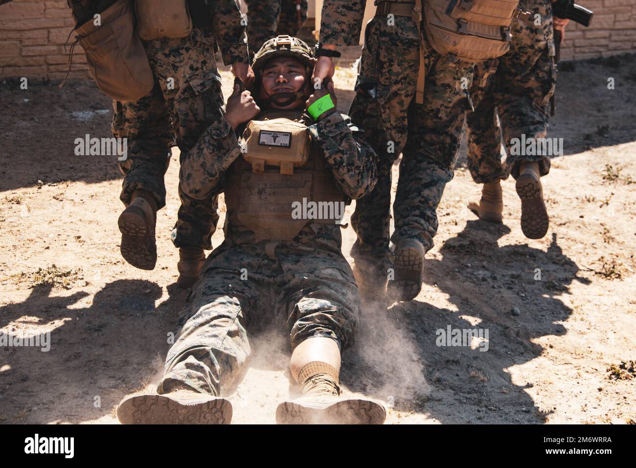 U.S. Navy hospital corpsmen with I Marine Expeditionary Force drag ...