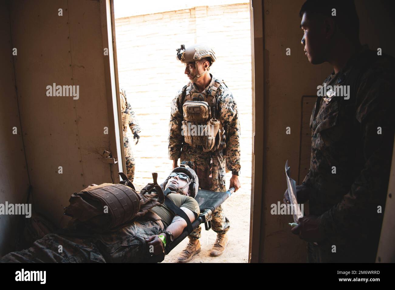 U.S. Navy hospital corpsmen with I Marine Expeditionary Force drag ...