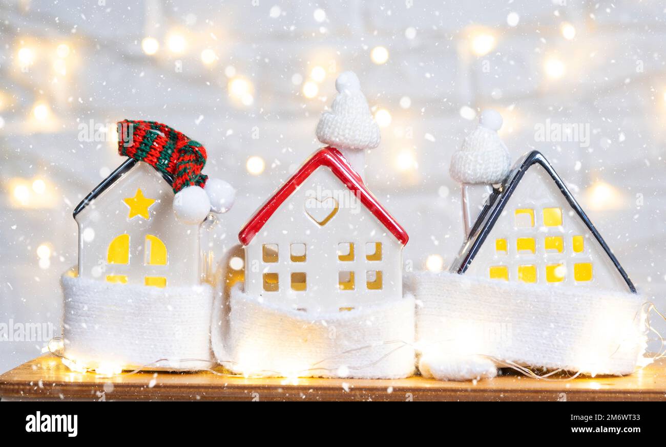 Cozy house is wrapped in a hat and scarf in a snowstorm -window sill ...