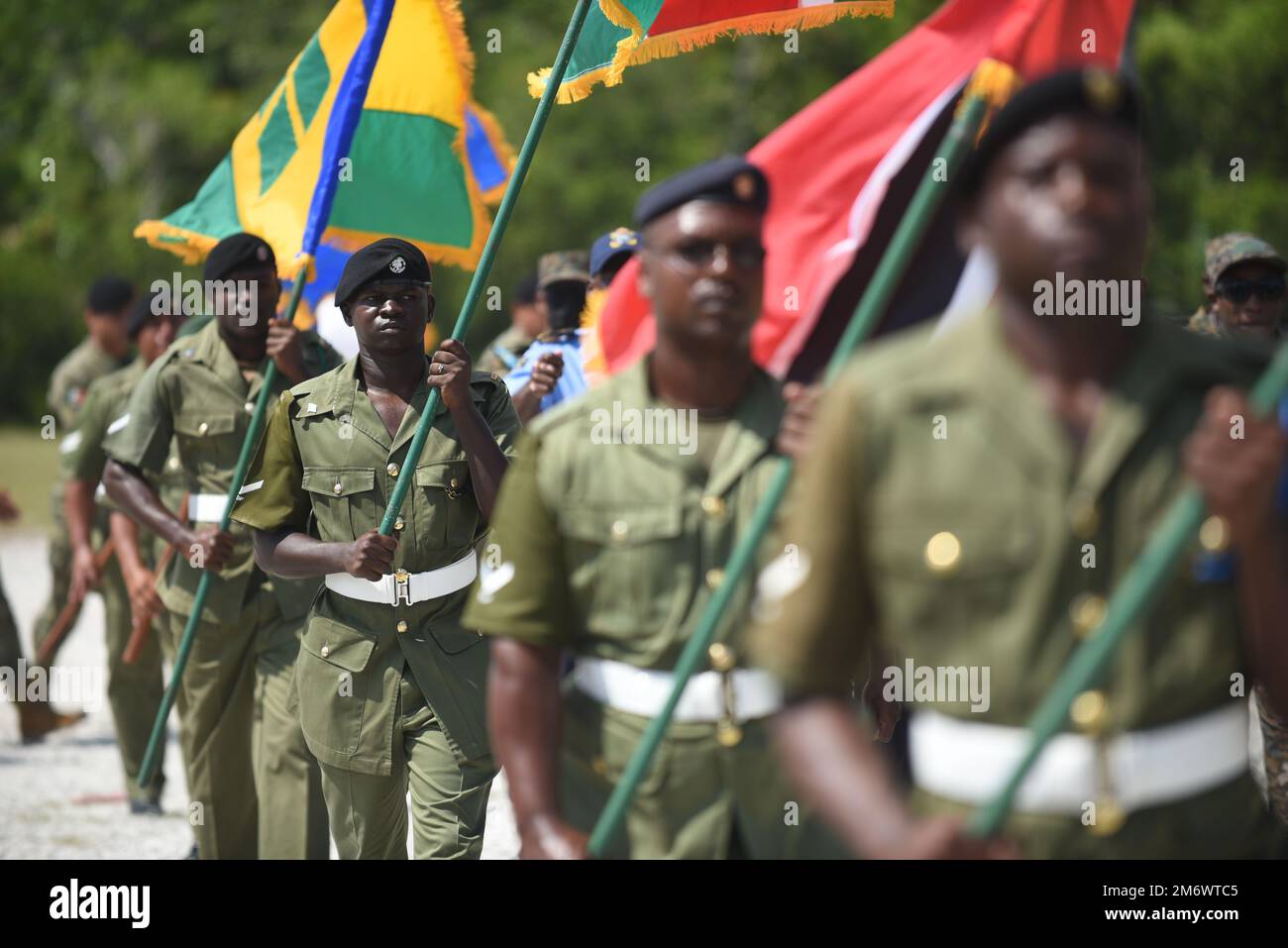 Members from the Belize Defence Force depart the field at the end of ...