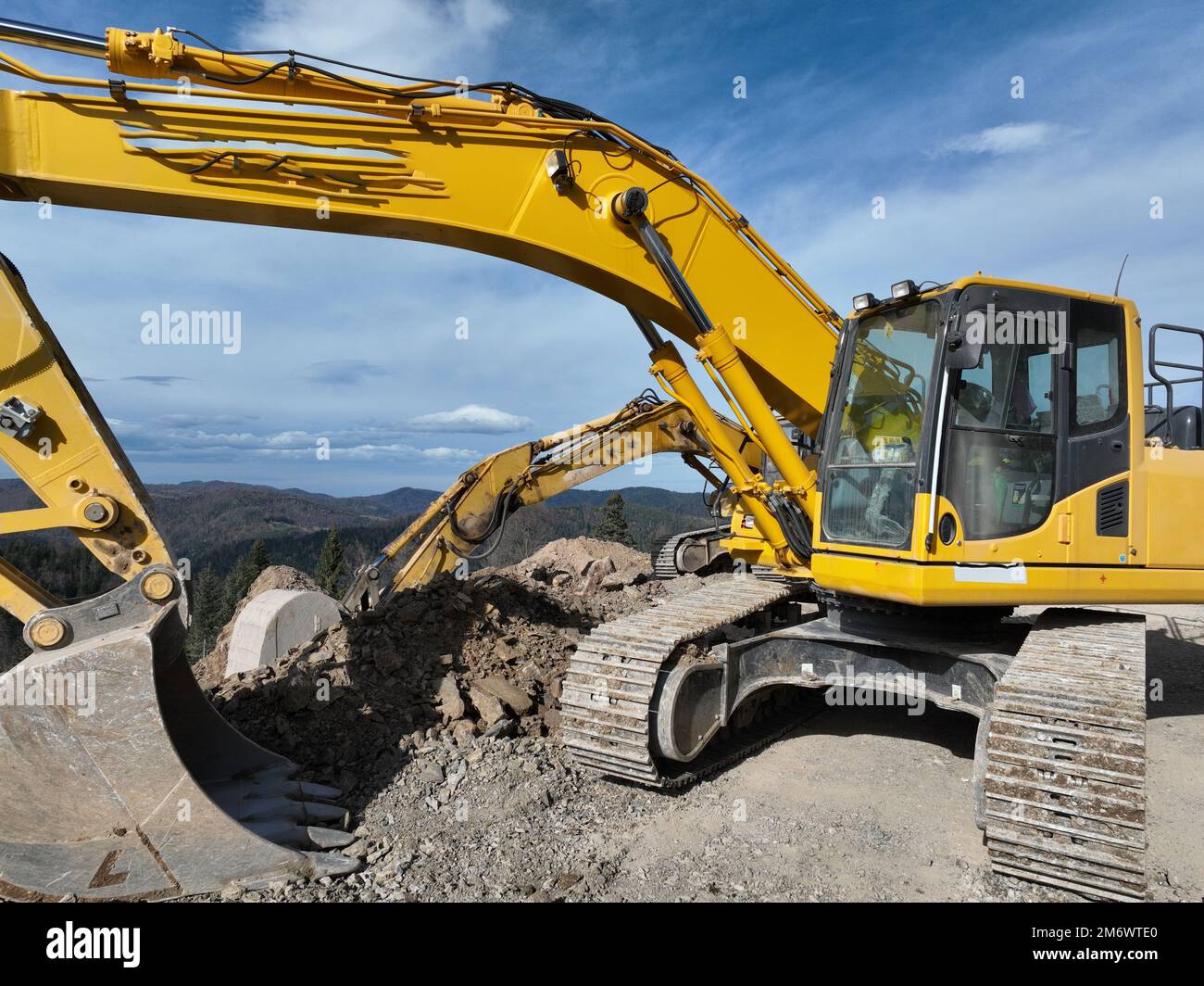 Industrial mine excavators are digging the soil in the construction ...