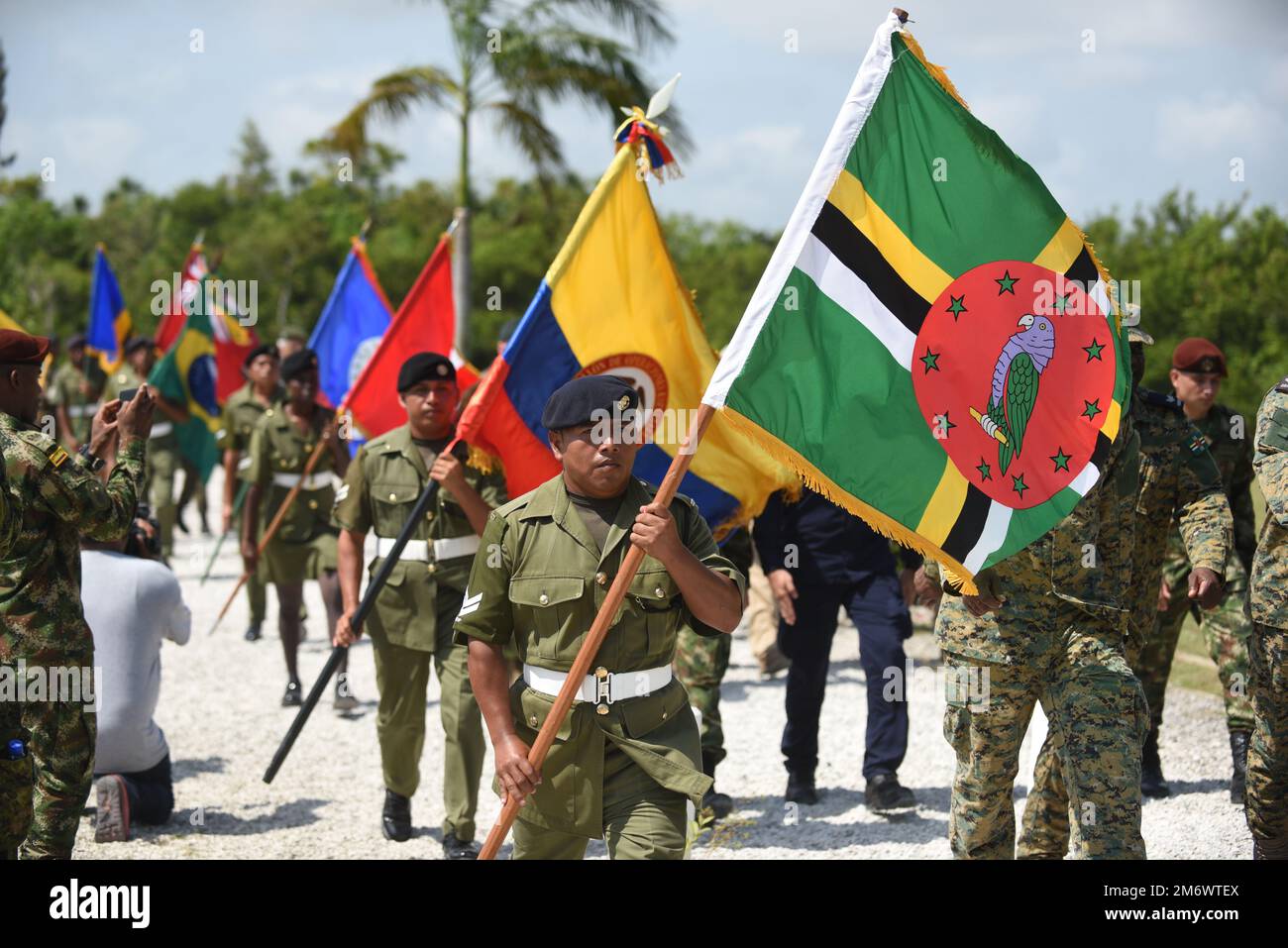 Members from the Belize Defence Force depart the field at the end of ...
