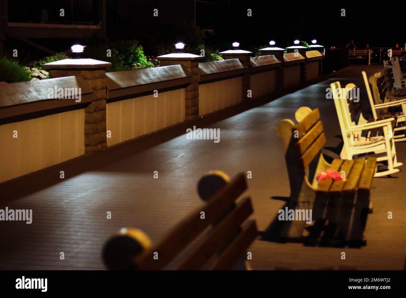 Lights and benches at night on the boardwalk Stock Photo - Alamy