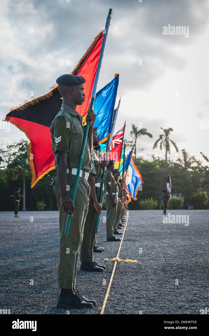 Belize Defence Force flag-bearers hold each of the 23 participating ...