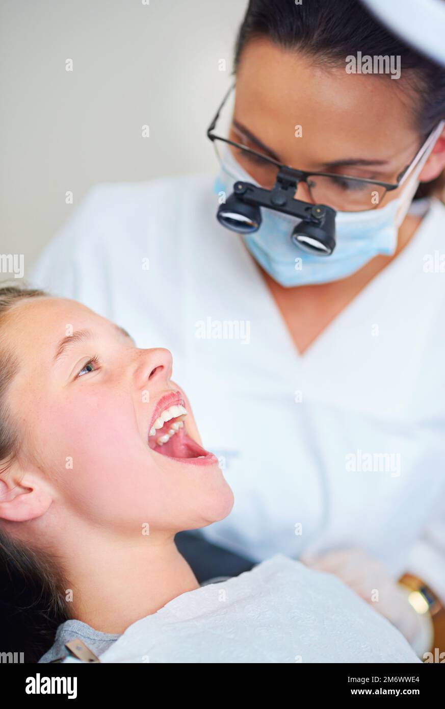 They look in perfect shape. a female dentist and child in a dentist ...