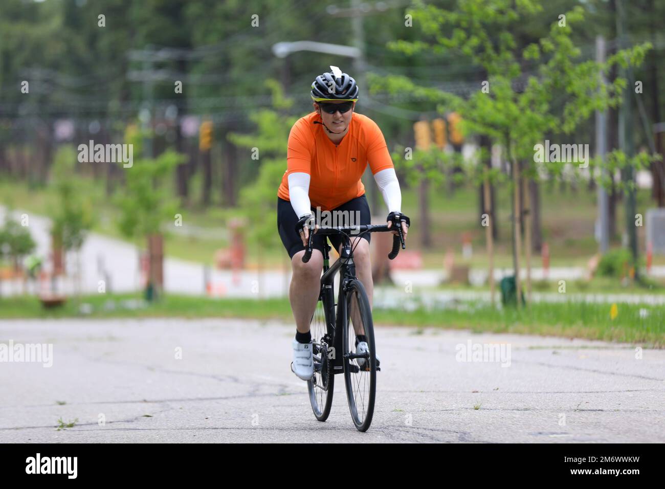 U.S. Army Maj. Victoria Camire cycles through in the cycing event ...