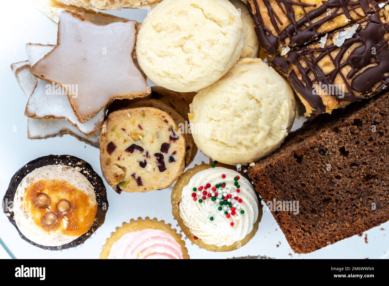 Collection of sweet treats on a white background Stock Photo - Alamy