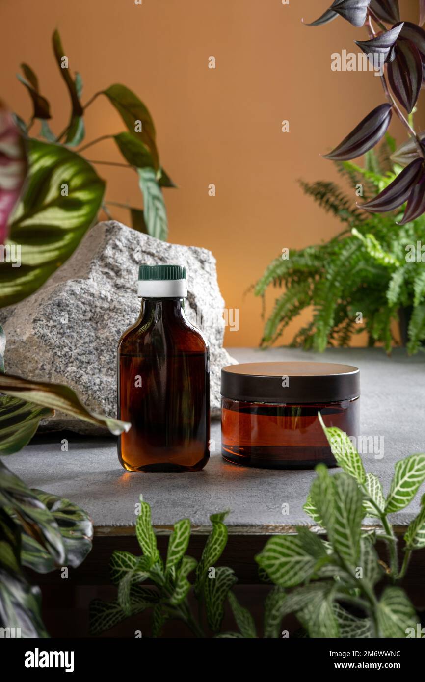 Ð¡osmetic product branding with tropical leaves on tan color background ...