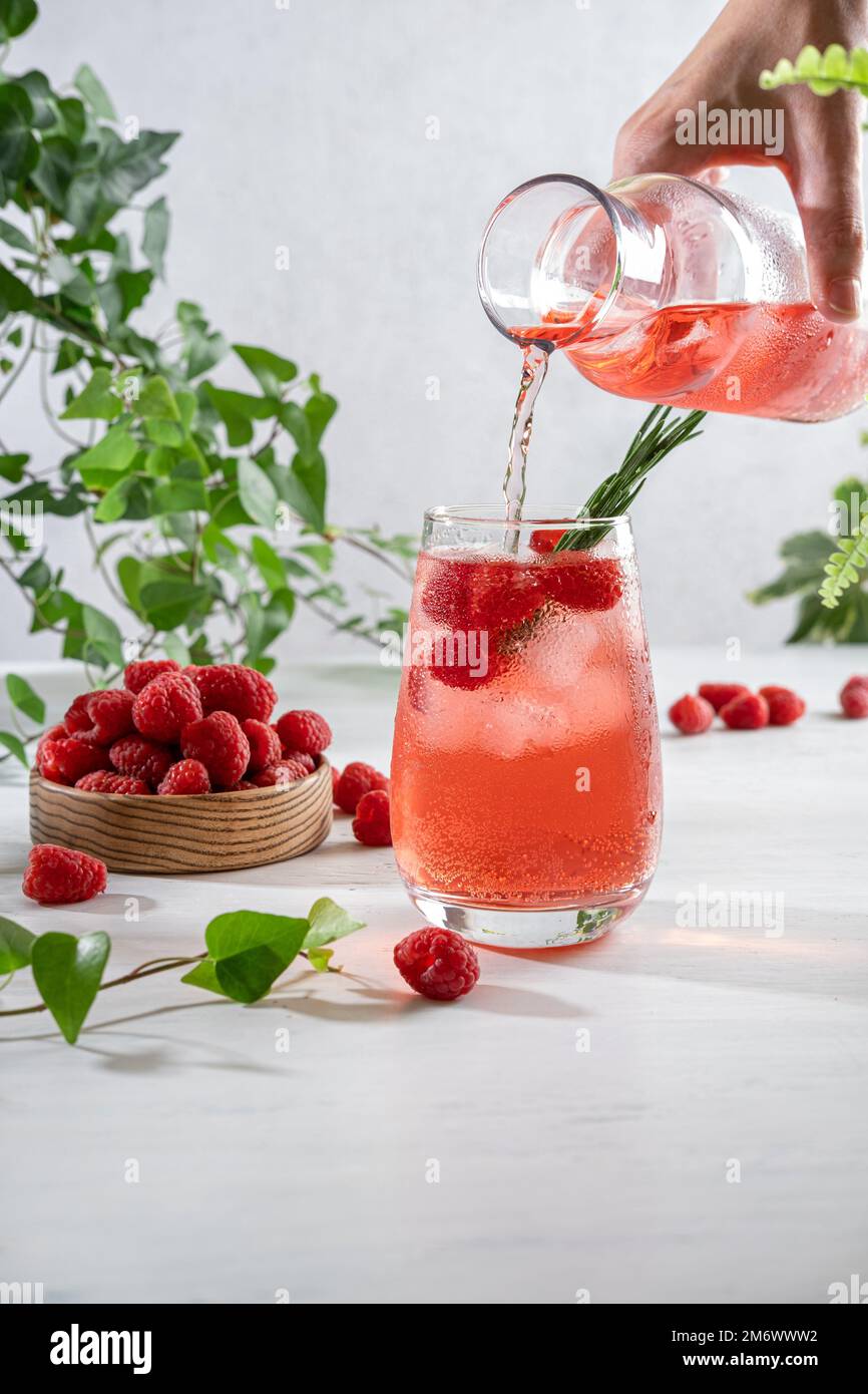 Summer refreshing non-alcoholic cocktails. Raspberry lemonade garnished ...