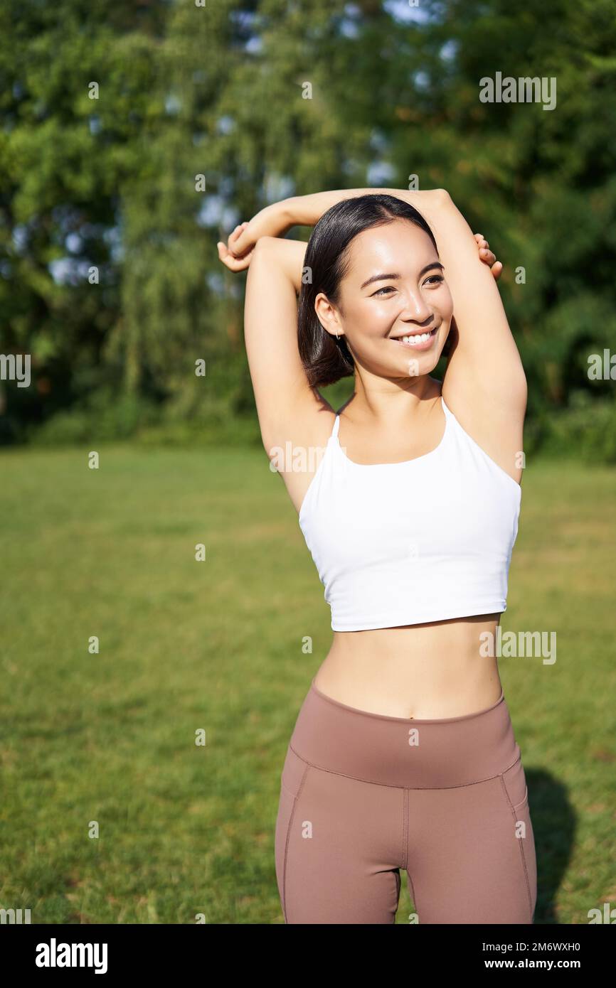 Female happy jogging arms air hi-res stock photography and images - Alamy