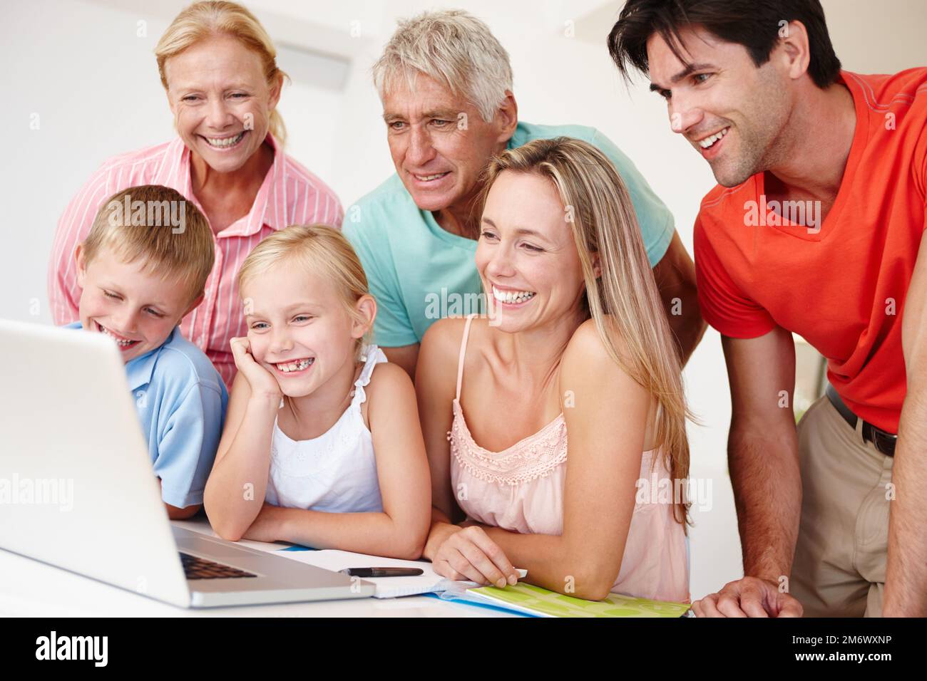 Browsing through some family photos. a happy multi-generational family ...
