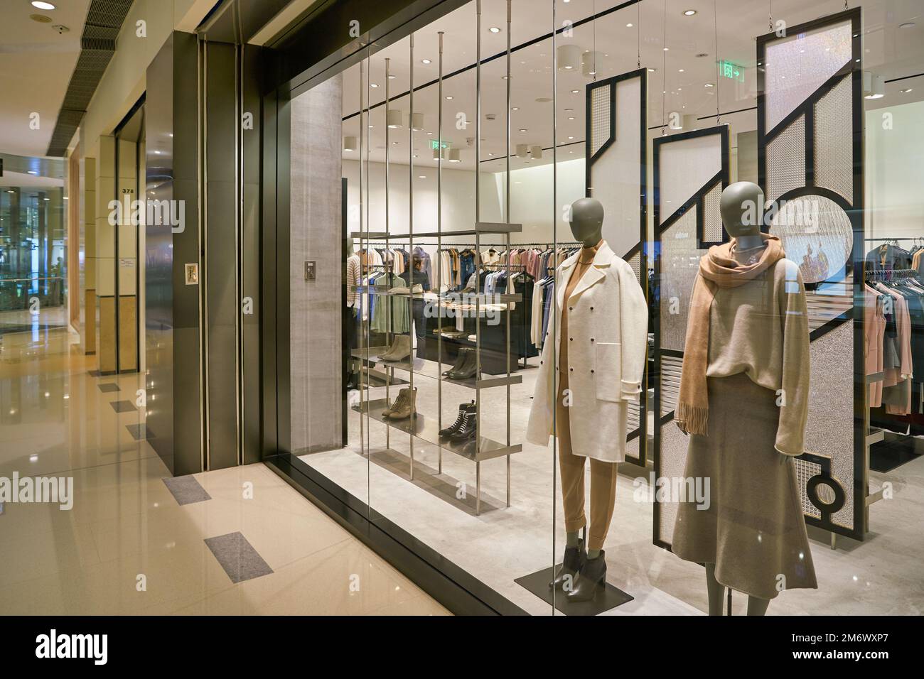 SHENZHEN, CHINA - CIRCA NOVEMBER, 2019: dressed mannequins on display at Theory store in ...