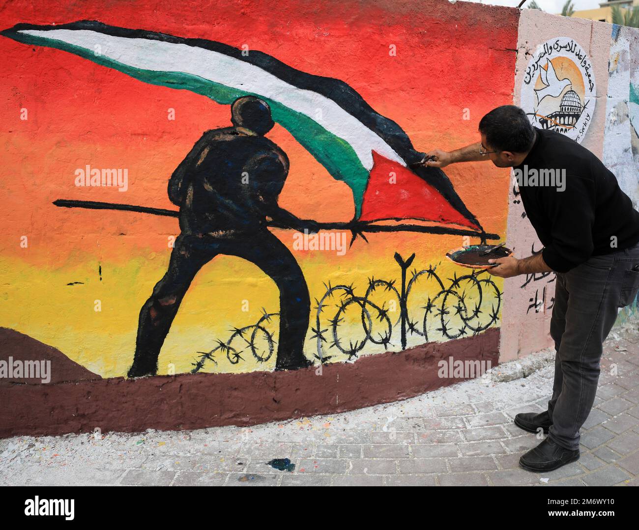 Gaza, Palestine. 05th Jan, 2023. An artist paints a mural dedicated to ...