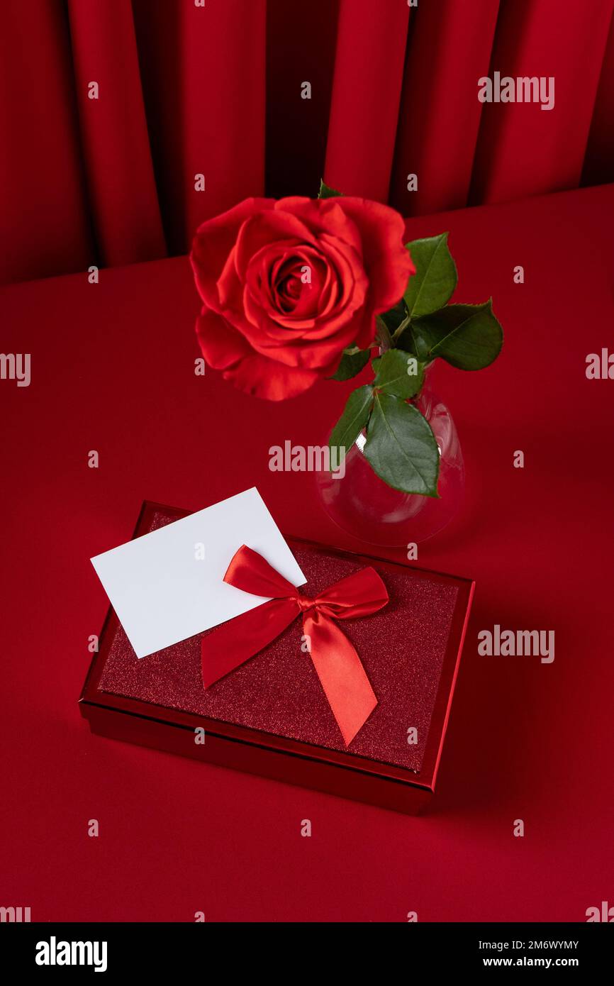 Valentine's Day blank message card with red rose and red gift box ...