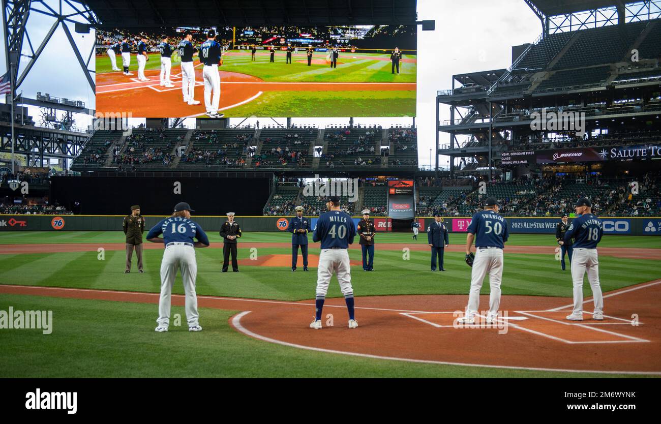Service members prepare to throw the first pitch to Seattle Mariners ...