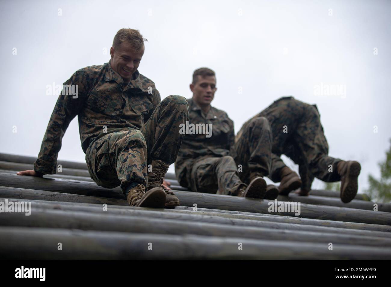 U.S. Marines with 3rd Marine Logistics Group, slide down an obstacle ...