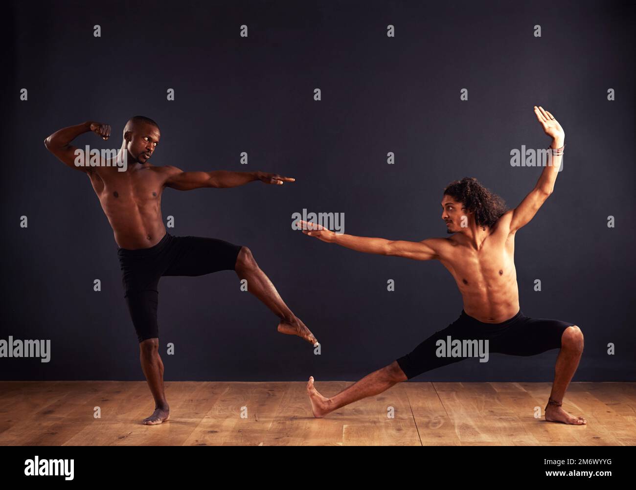 Worthy challengers. Two male contemporary dancers performing a dramatic ...