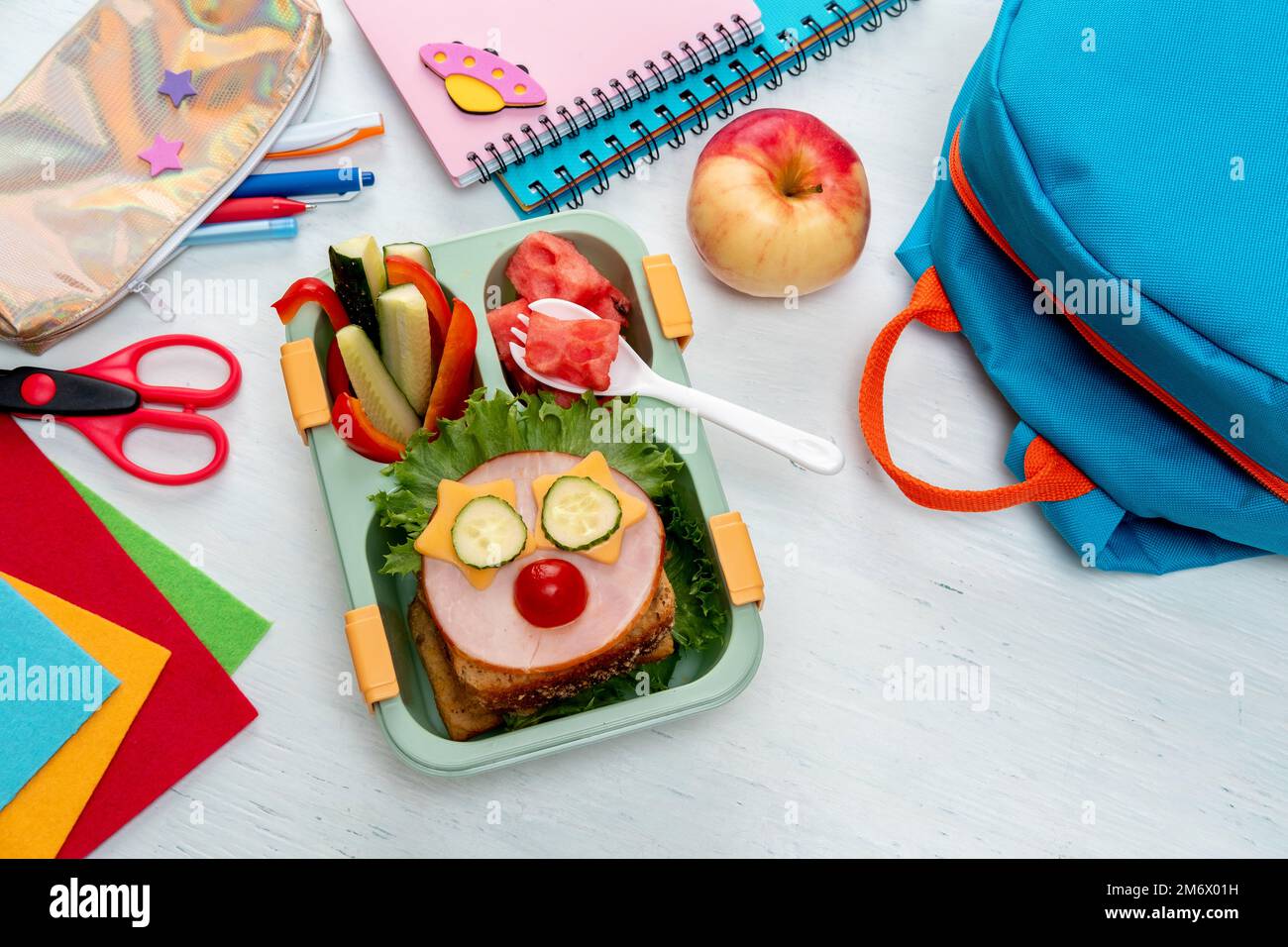 School lunch box for kids with food in the form of funny faces. School ...