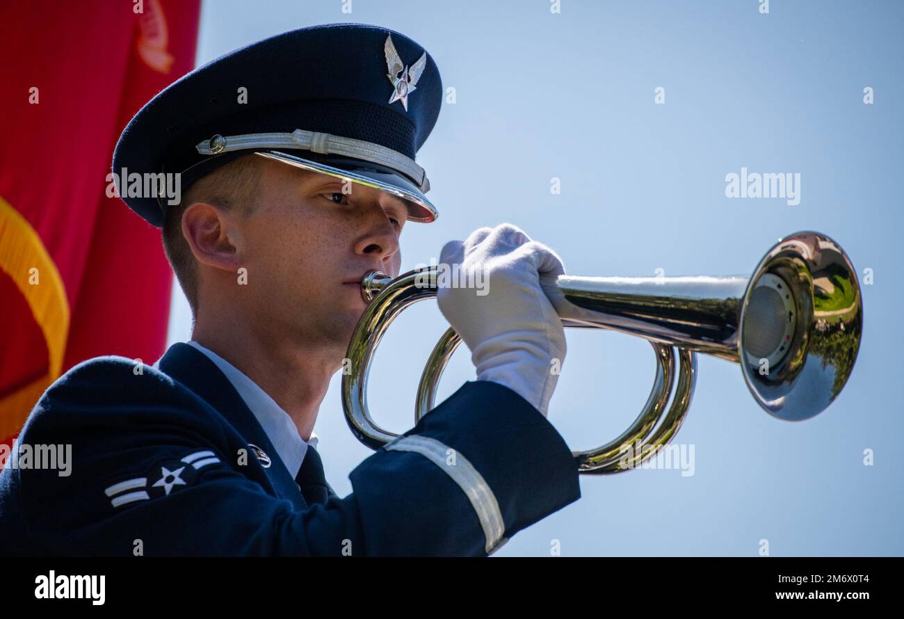 Airman 1st Class Jarod Holley, Air Force Honor Guard, holds a bugle as ...