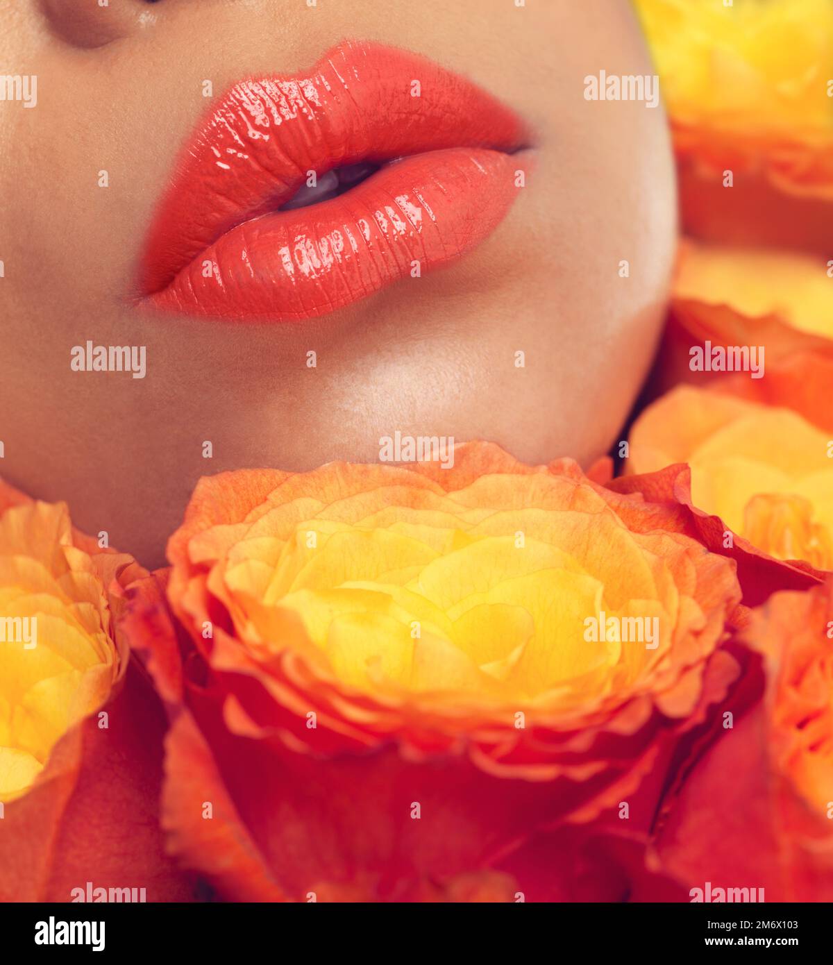 Surrounded by the beauty of nature. a young woman surrounded by flowers ...