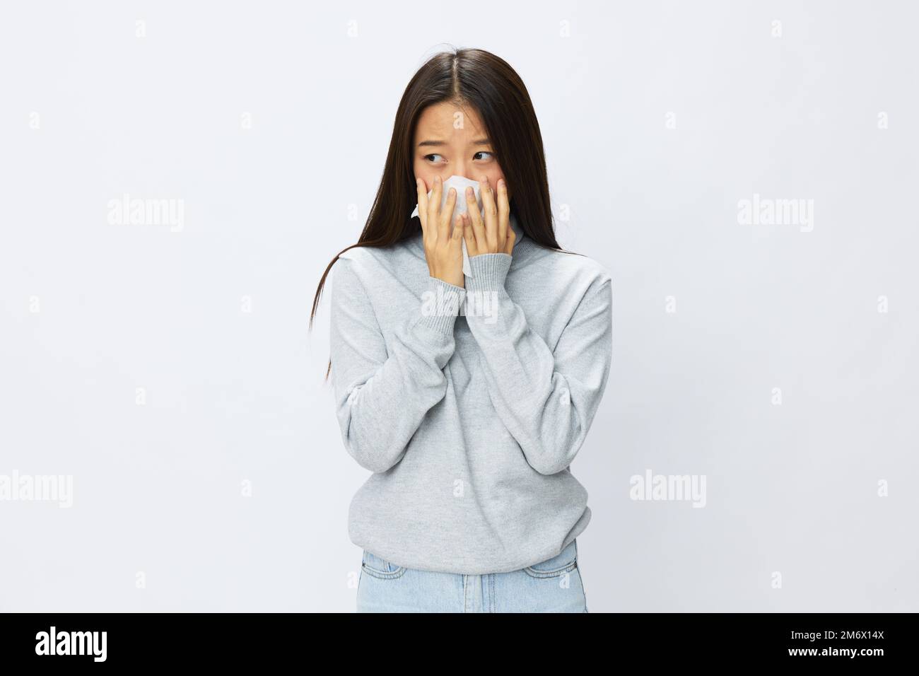 Asian woman holding hand with handkerchief and coughing up flu and cold ...