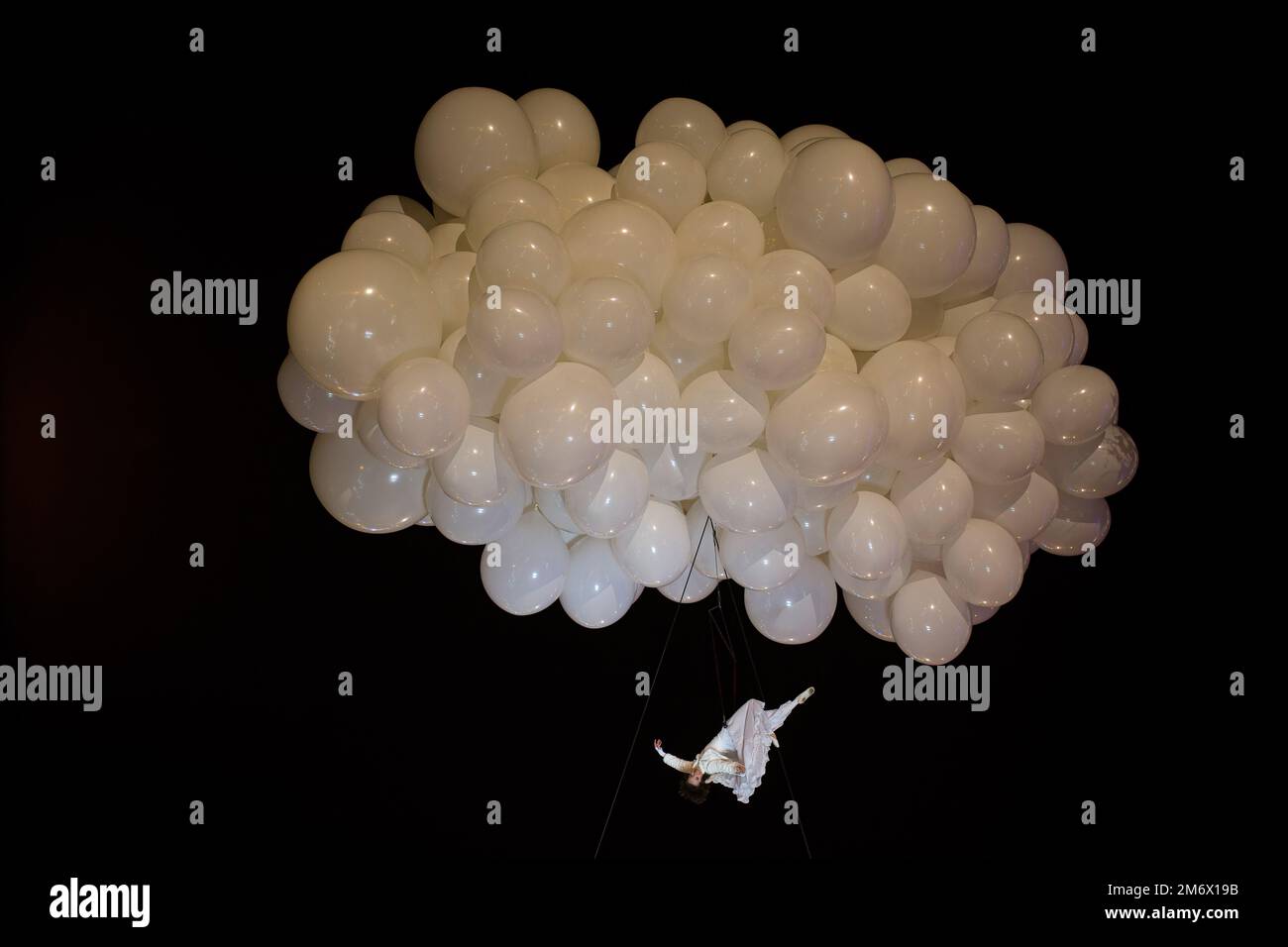 Madrid, Spain. 05th Jan, 2023. A female acrobat hangs from hundreds of ...