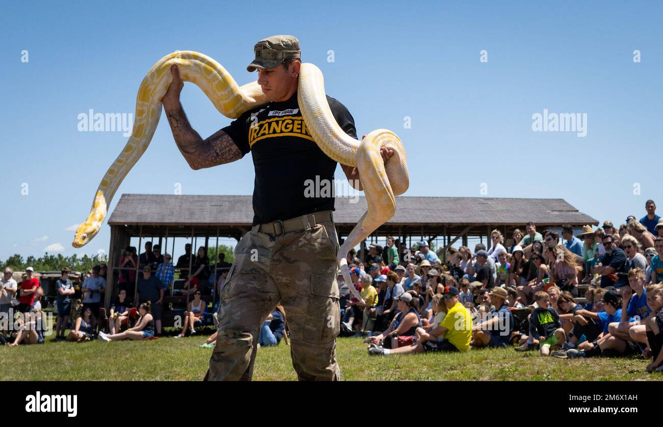 Capt. Christopher Figari, 6th Ranger Training Battalion, carries around ...