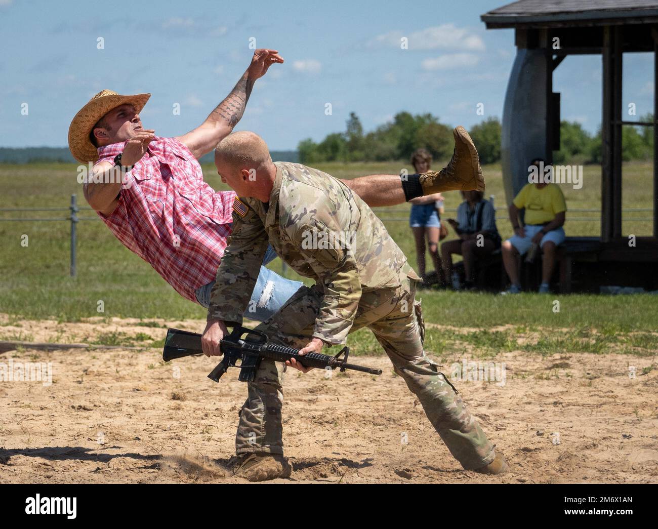 An Army Ranger takes down a rowdy fan during a combat demonstration at ...