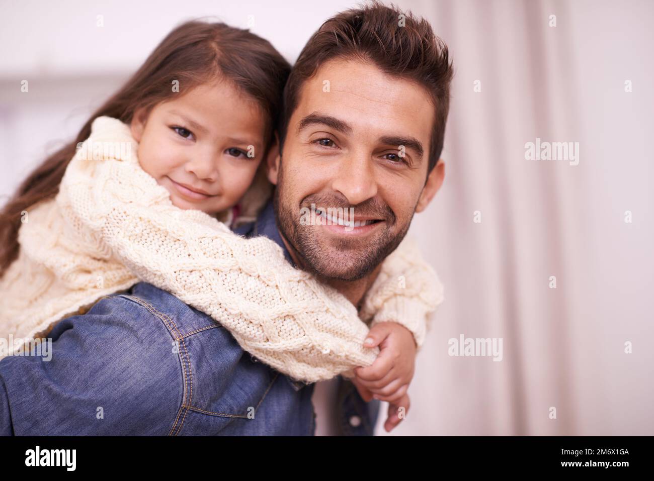 Shes Daddys little princess. a father giving his daughter a piggyback ...