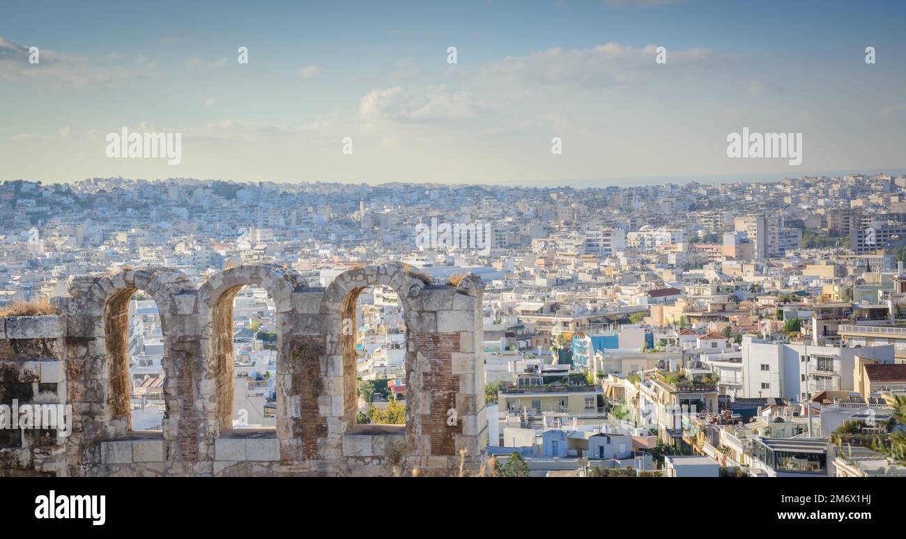 View of modern city of Athens and ancient arches Stock Photo - Alamy