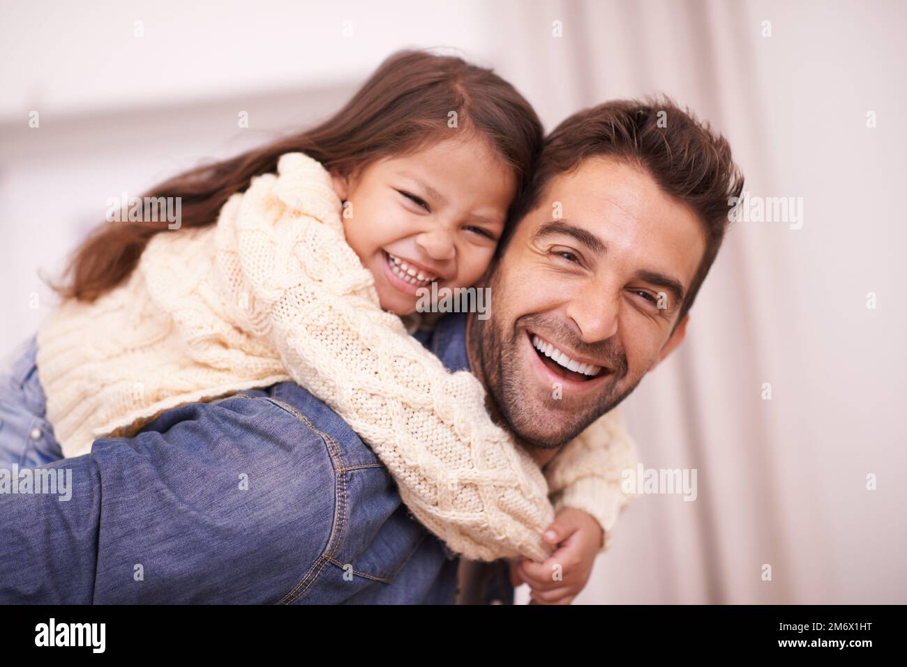 Having so much fun together. a father giving his daughter a piggyback ...