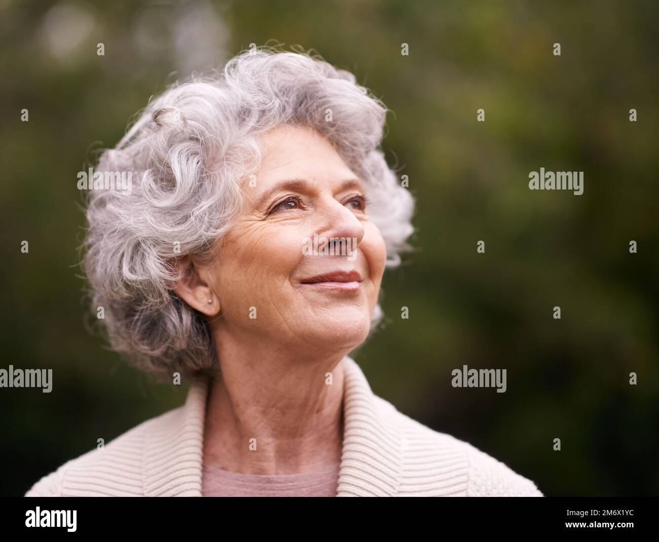Aging gracefully. a senior woman standing outside Stock Photo - Alamy