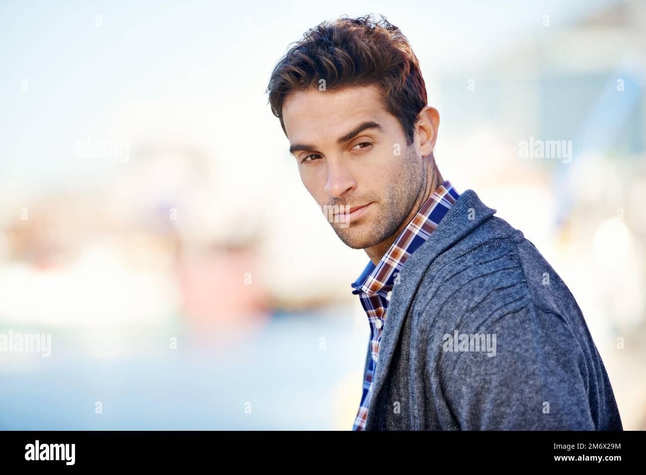 Keeping it cool. a handsome young man spending a day outdoors Stock ...