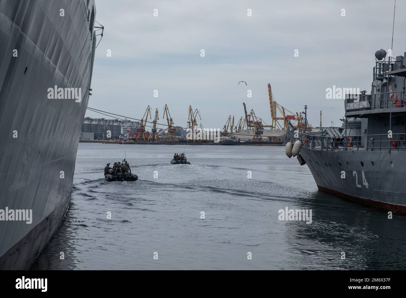U.S. Naval Special Warfare (SEALS) depart in Zodiac crafts with ...