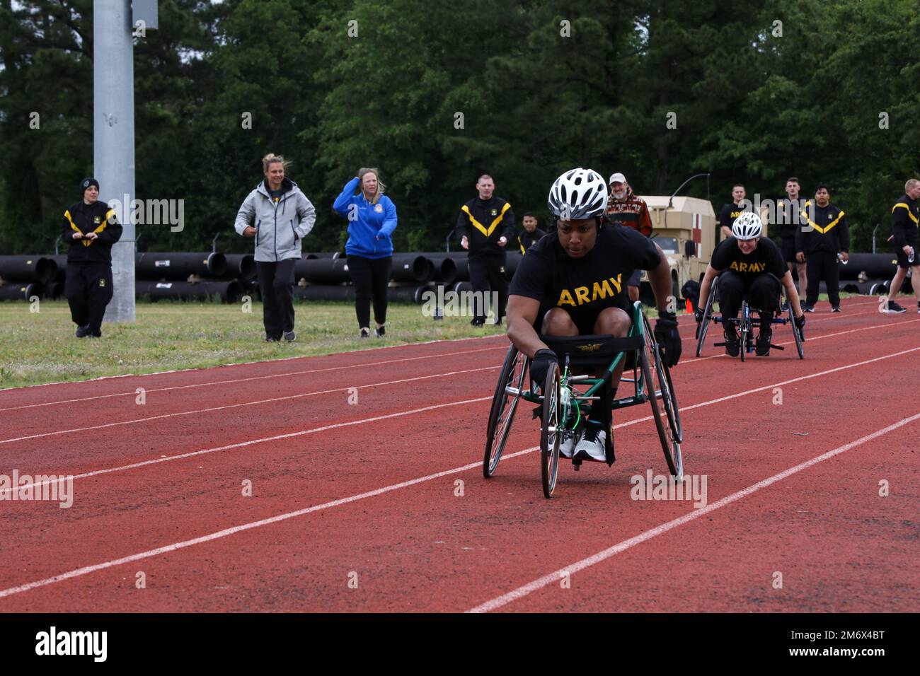 U.S. Army Spc. Corine Hamilton leads the way in the 200 meter racing ...