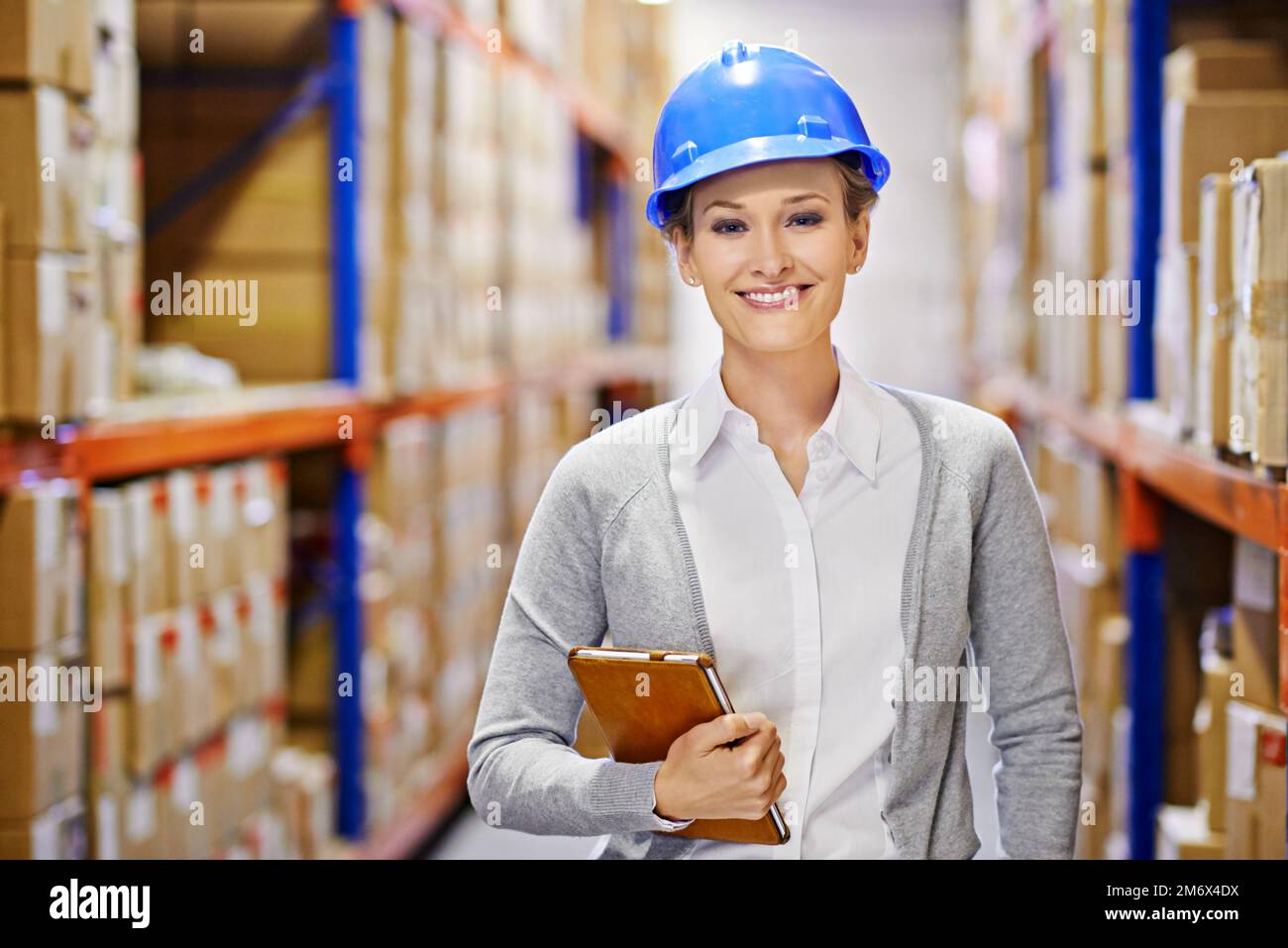 I know this warehouse inside and out. a woman at work in a storage ...