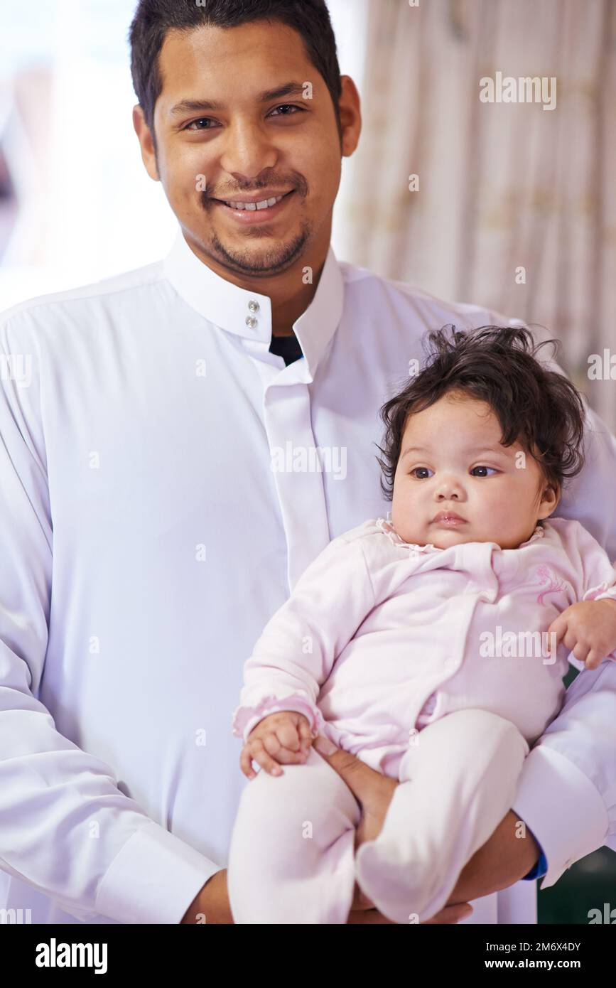 Look at how big she is. a father cradling his little baby girl Stock ...