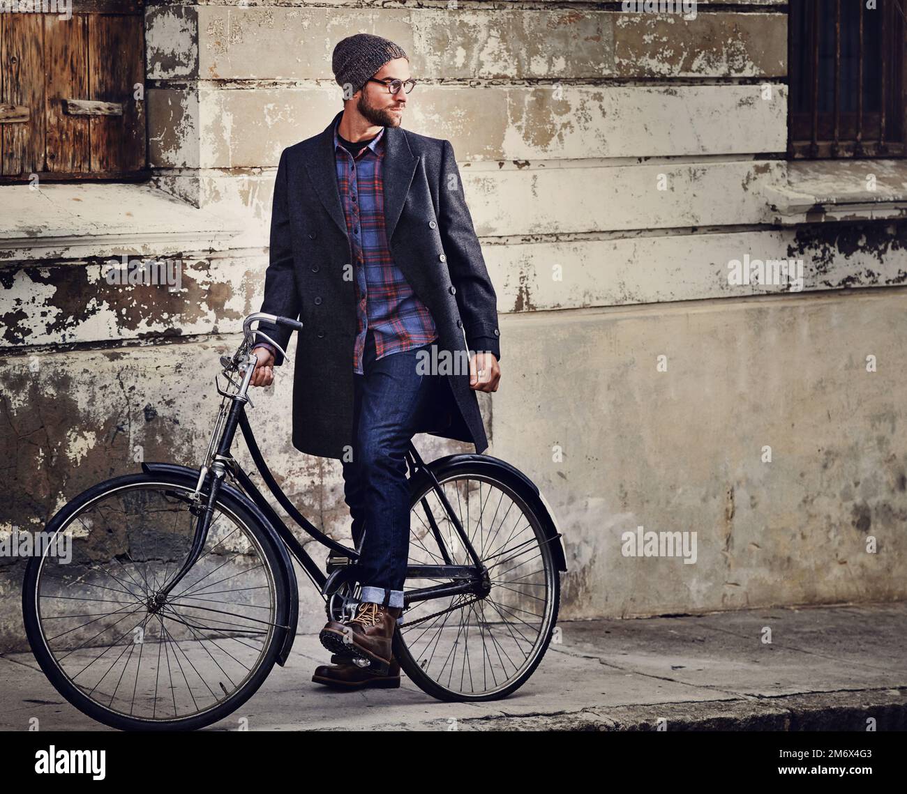 Man seated on bike hi-res stock photography and images - Alamy