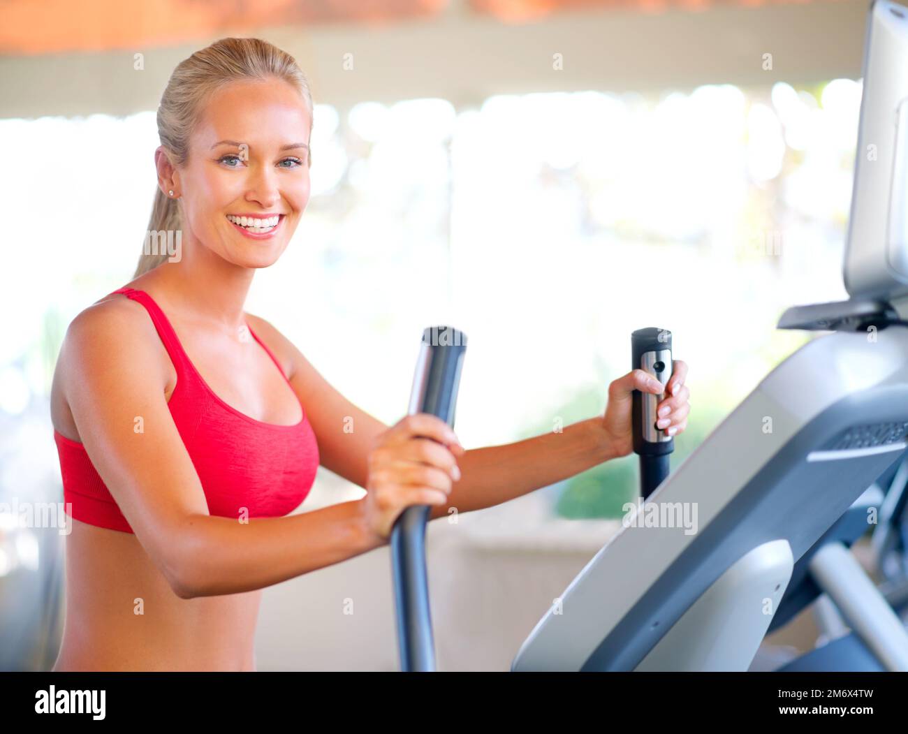 Time to step up this workout. a beautiful young woman working out on a ...
