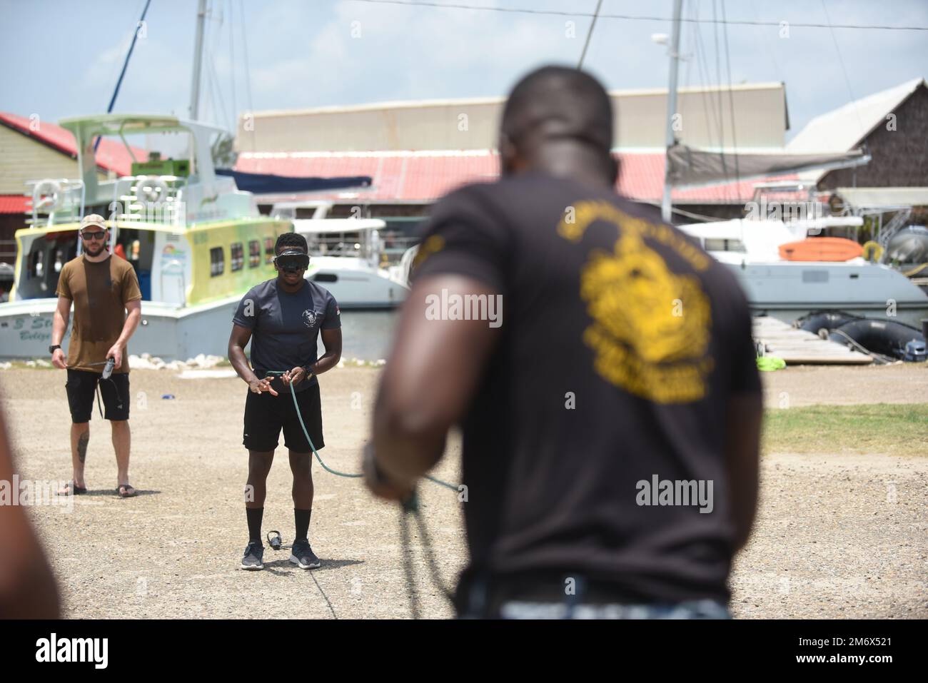 A member of the Trinidad and Tobago coast guard dive team practices ...