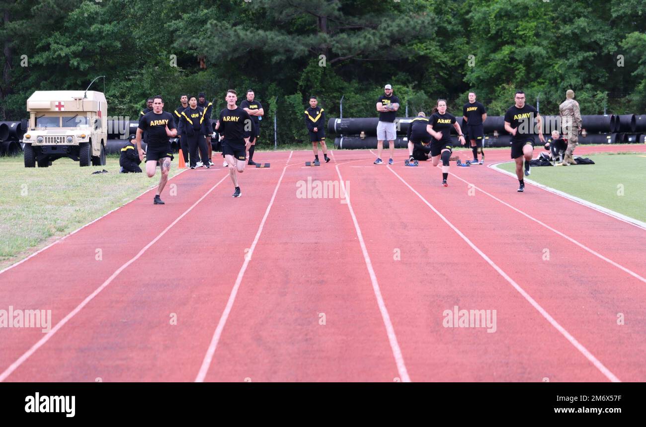 U.S. Army athletes sprint down the track in the 100-meter dash during ...